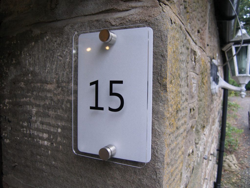 Fixing house signs and plaques