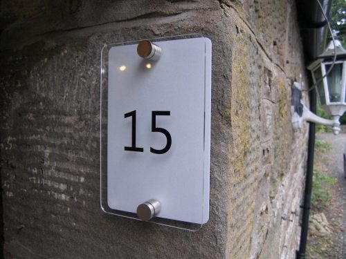 Fixing house signs and plaques